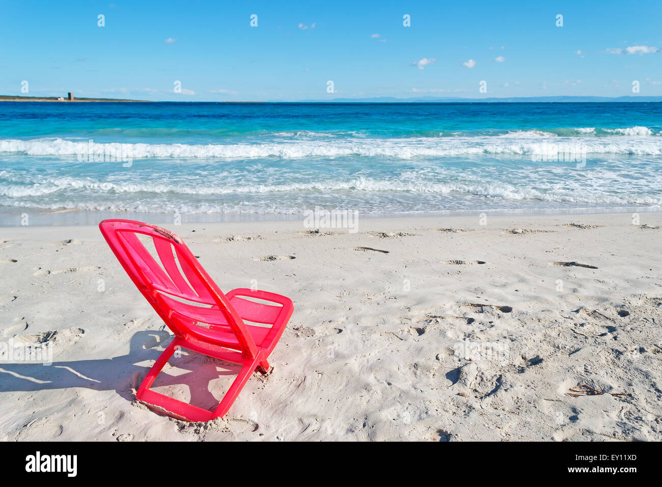 red beach chair on the sand Stock Photo - Alamy