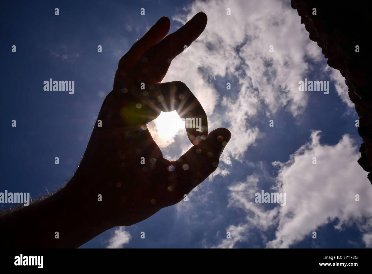 Hand over the Sky and Sun Stock Photo - Alamy