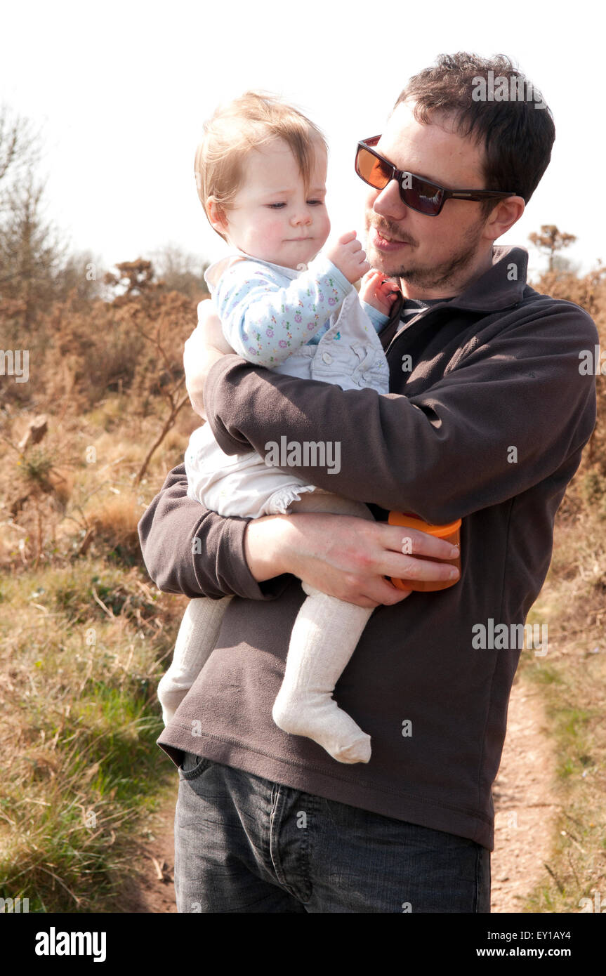 Father cuddling baby girl Stock Photo - Alamy