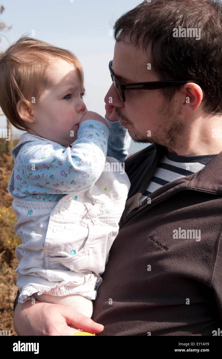 Father comforting baby girl Stock Photo - Alamy