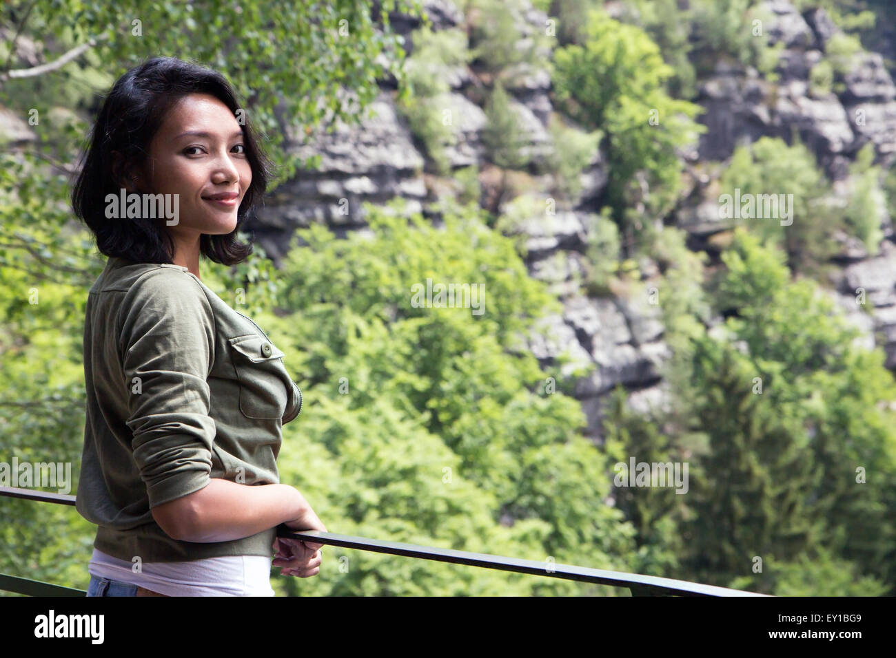 Woman on the lookout in nature Stock Photo - Alamy