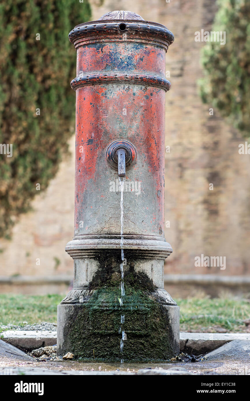 Drinking water running from an old water well Stock Photo - Alamy