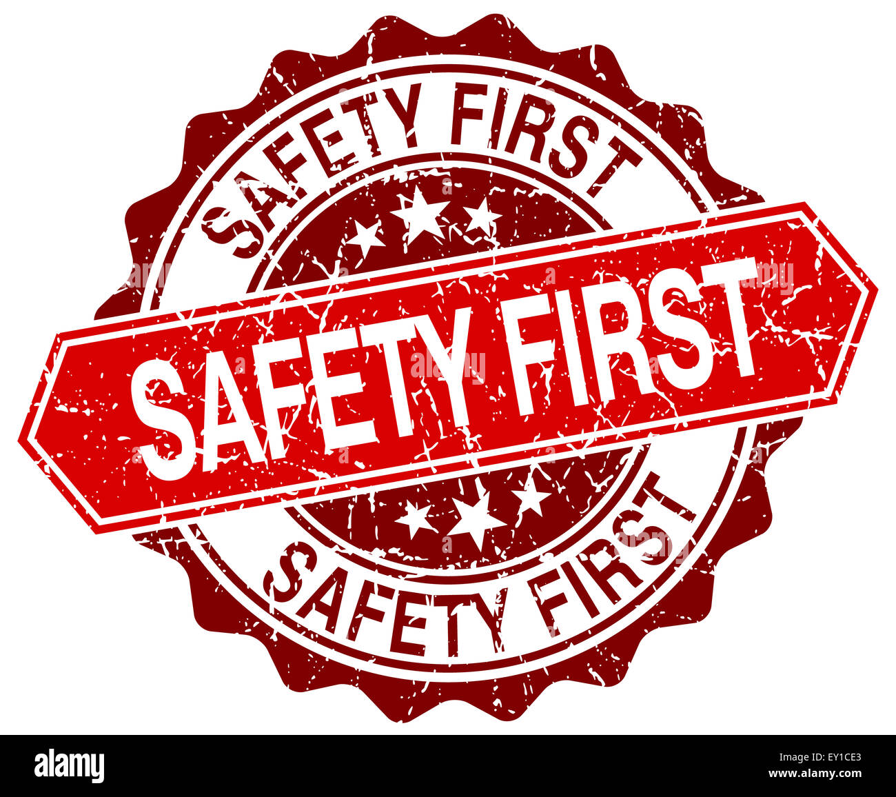 safety first red round grunge stamp on white Stock Photo - Alamy