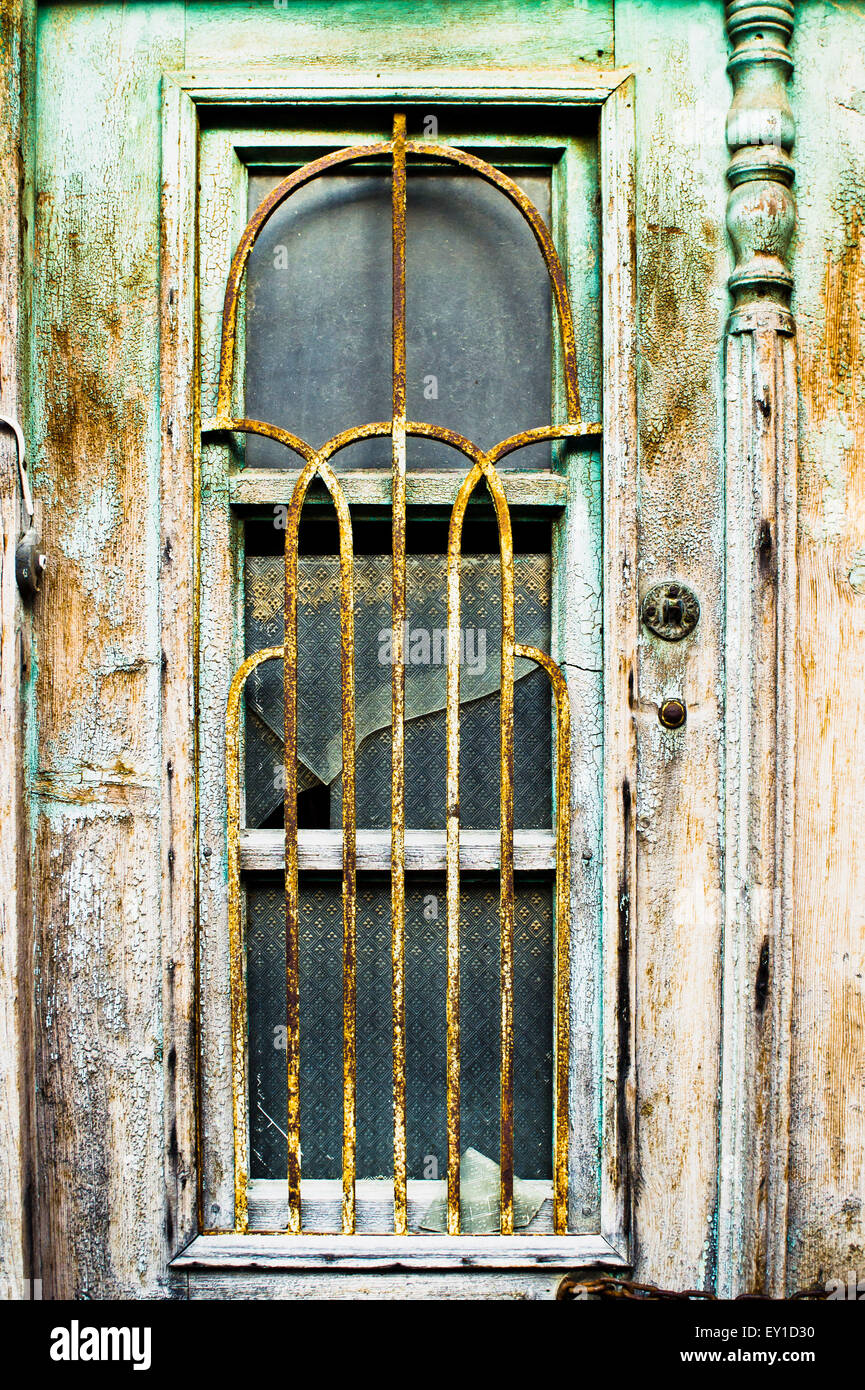 An old wooden window with broken glass and rusty metal bars Stock Photo ...