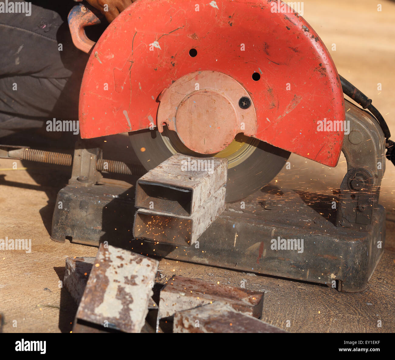 cutting a metal and steel with compound mitre saw with sharp, circular ...