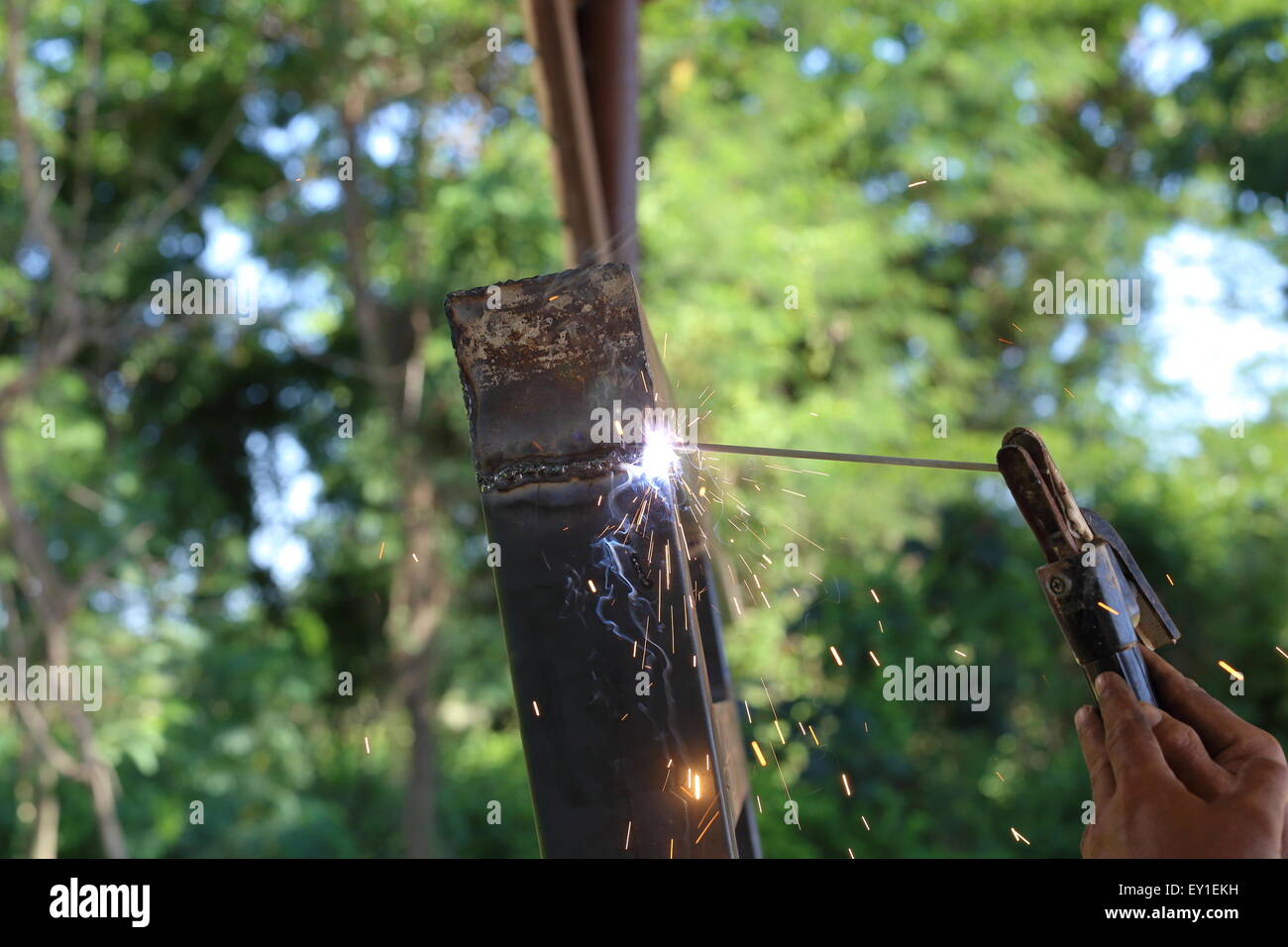 close up hand of worker welding metal Stock Photo - Alamy