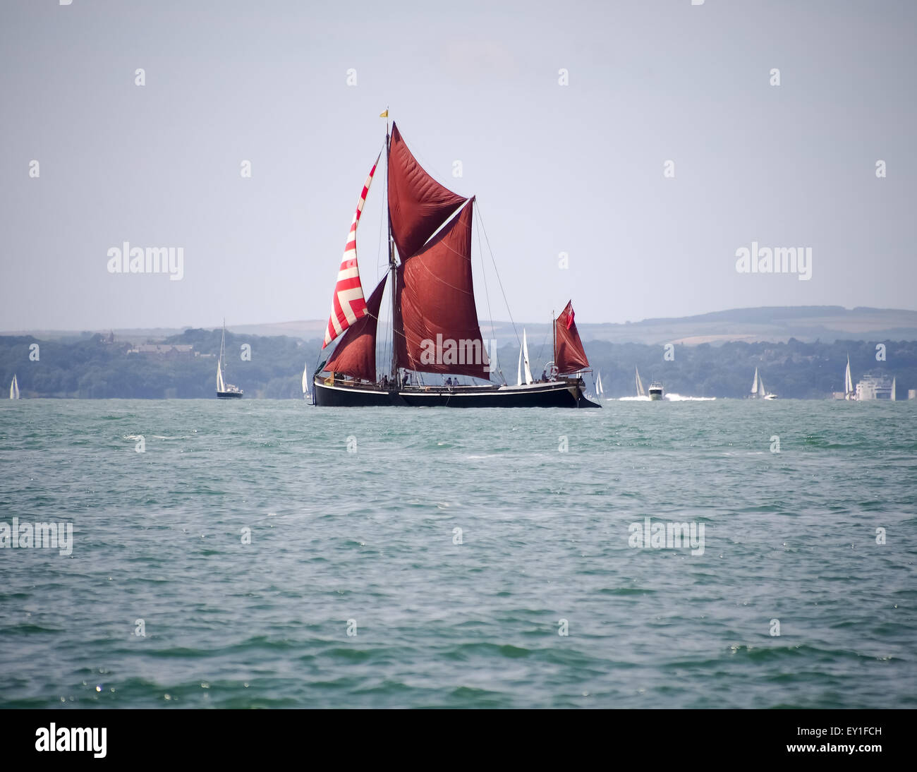 The Thames sailing barge Alice at full sail on the solent, England ...