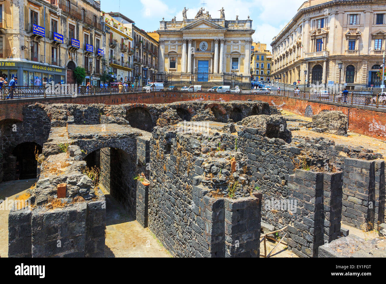 Remains of a Roman amphitheatre in Catania city centre with the ornate ...