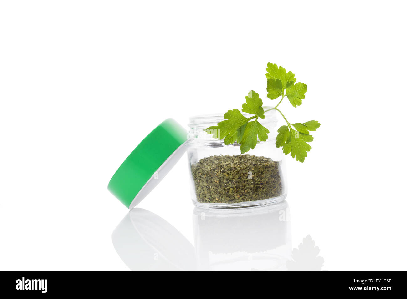 Fresh parsley leaf and dry parsley spice in glass jar isolated on white ...