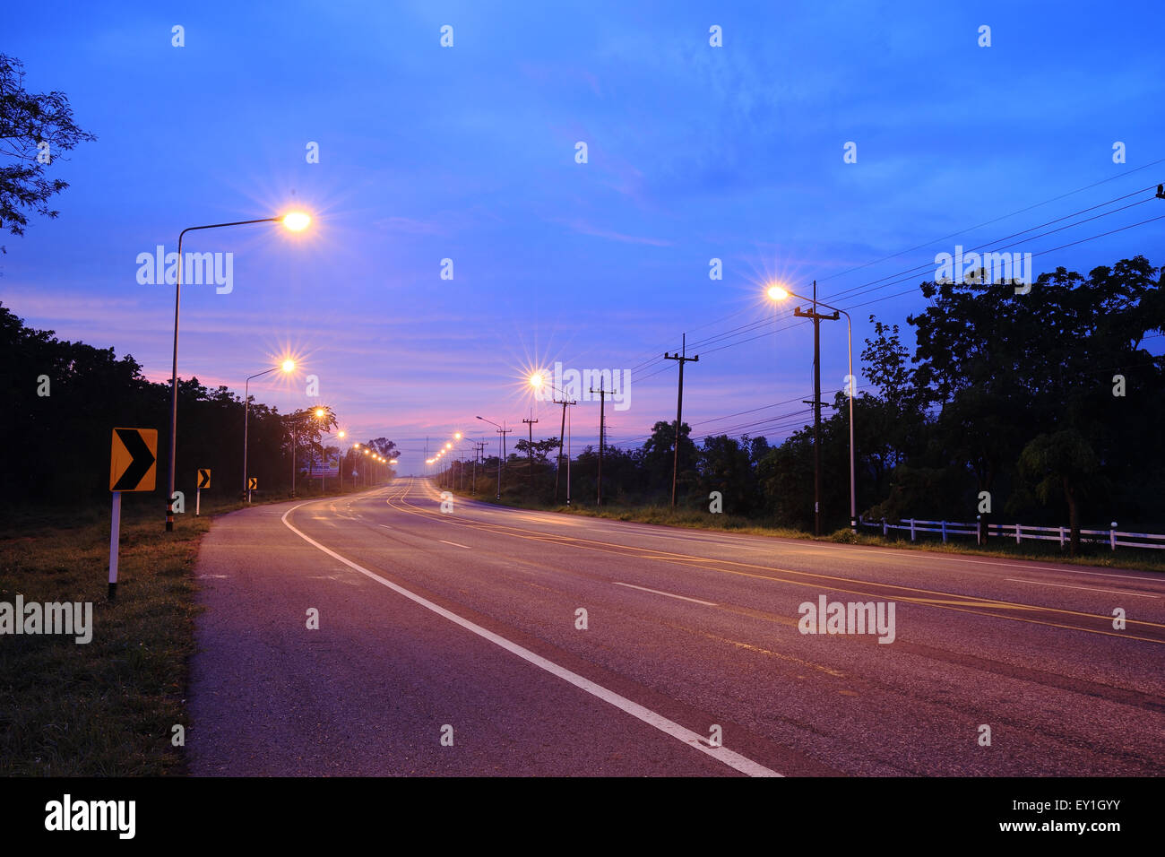 road with light pole at the night Stock Photo - Alamy
