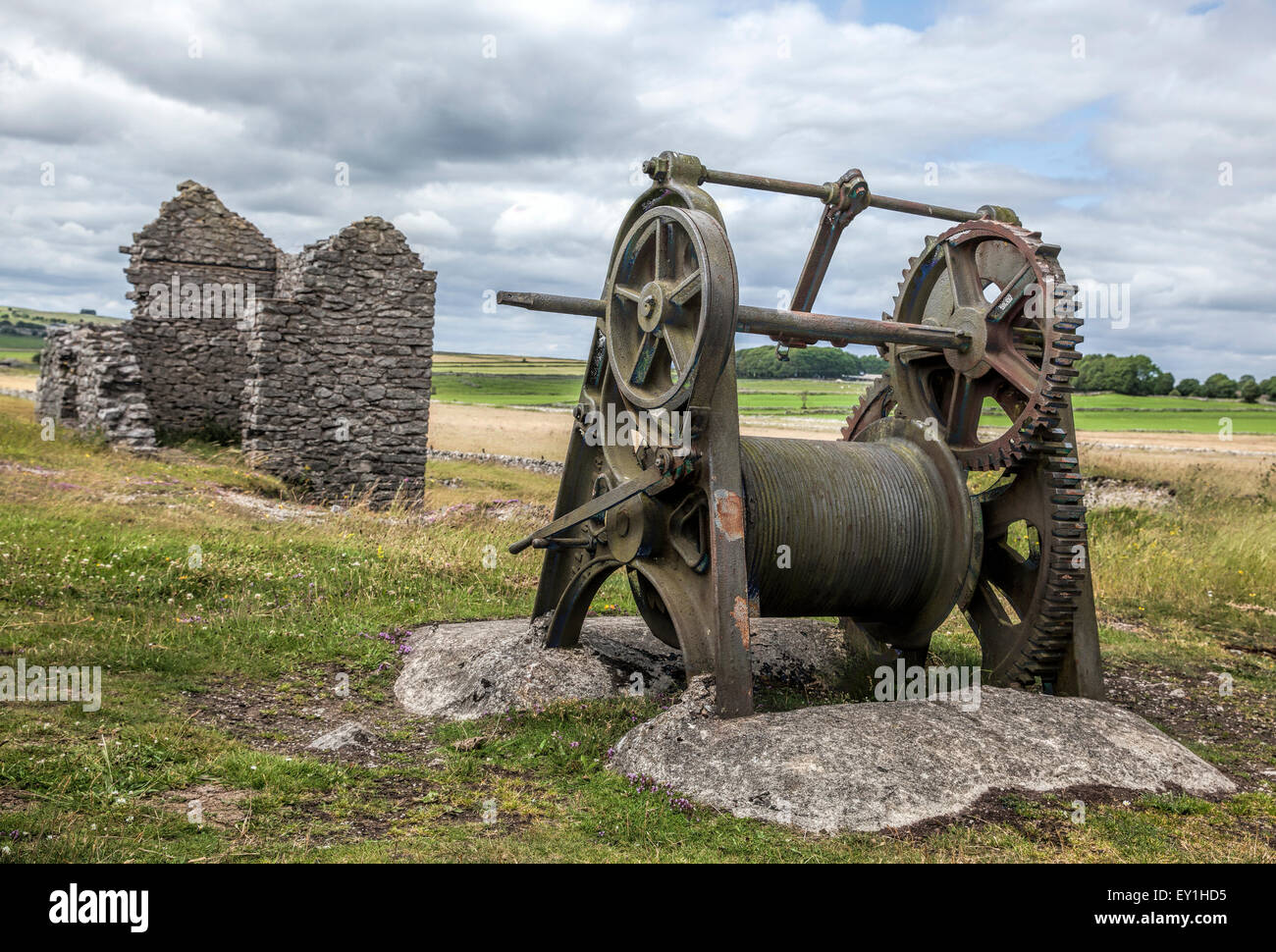 Winch and stone walls at a derelict lead mine in the Peak District in ...