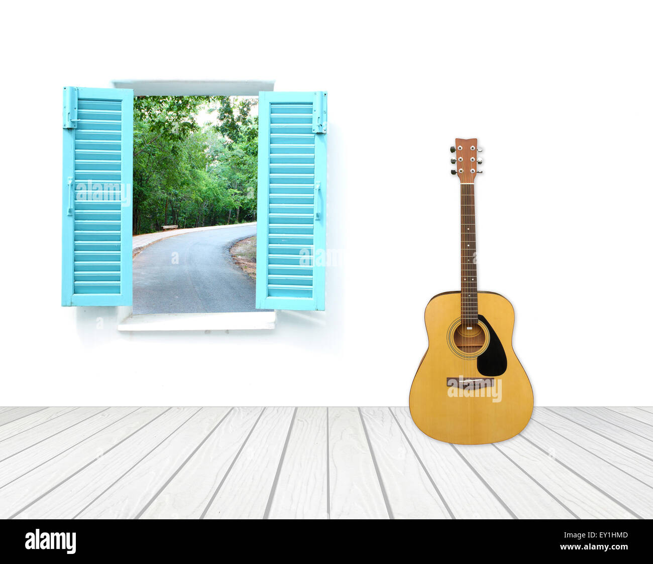 Guitar with window on cement wall and wood floor Stock Photo - Alamy
