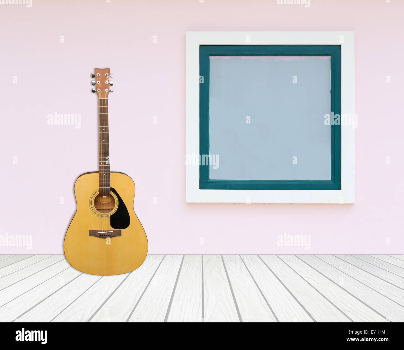 Guitar with window on cement wall and wood floor Stock Photo - Alamy