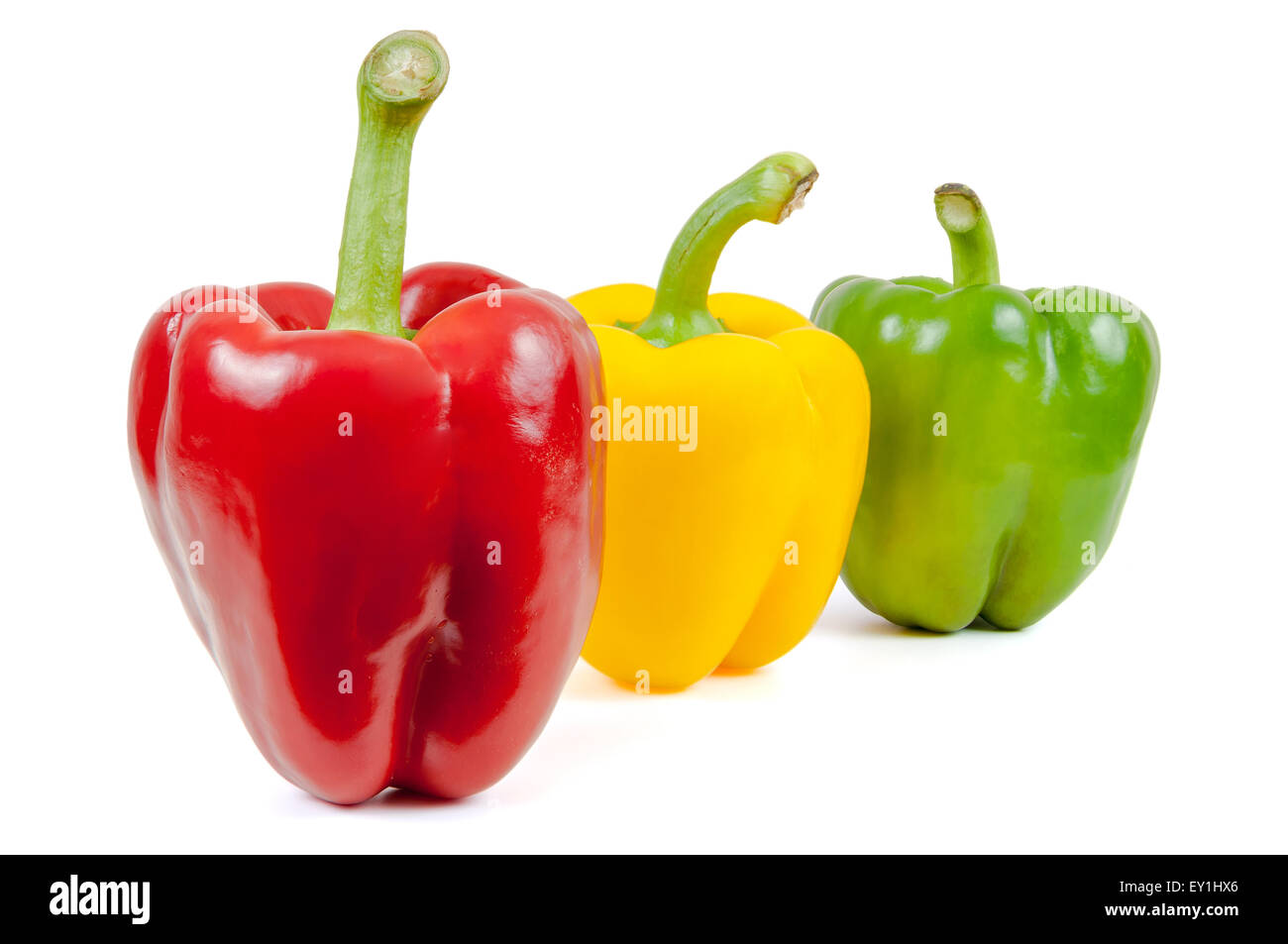 Three colored peppers isolated on white background with clipping path ...