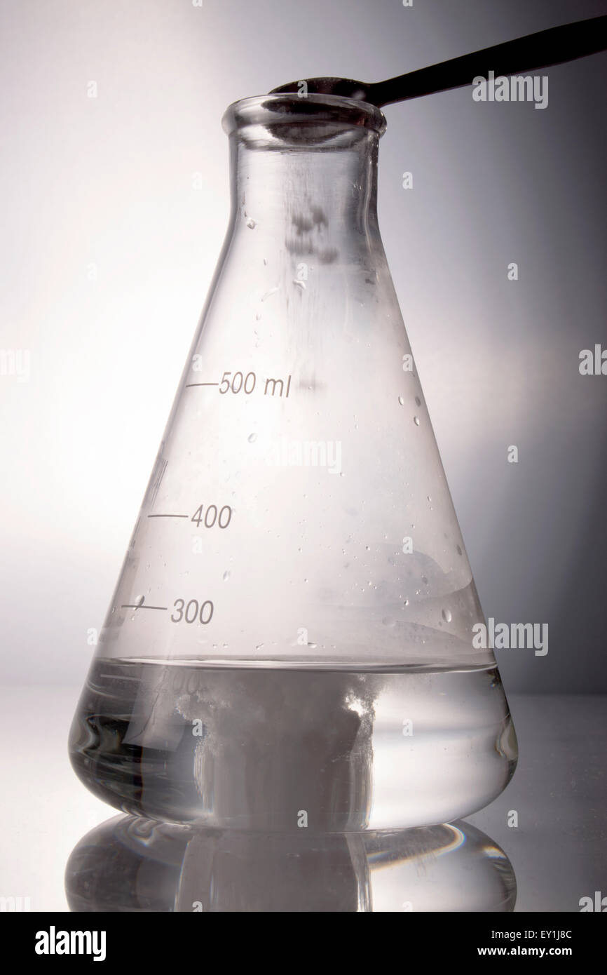 Chemical reaction with Erlenmeyer Flask Stock Photo - Alamy