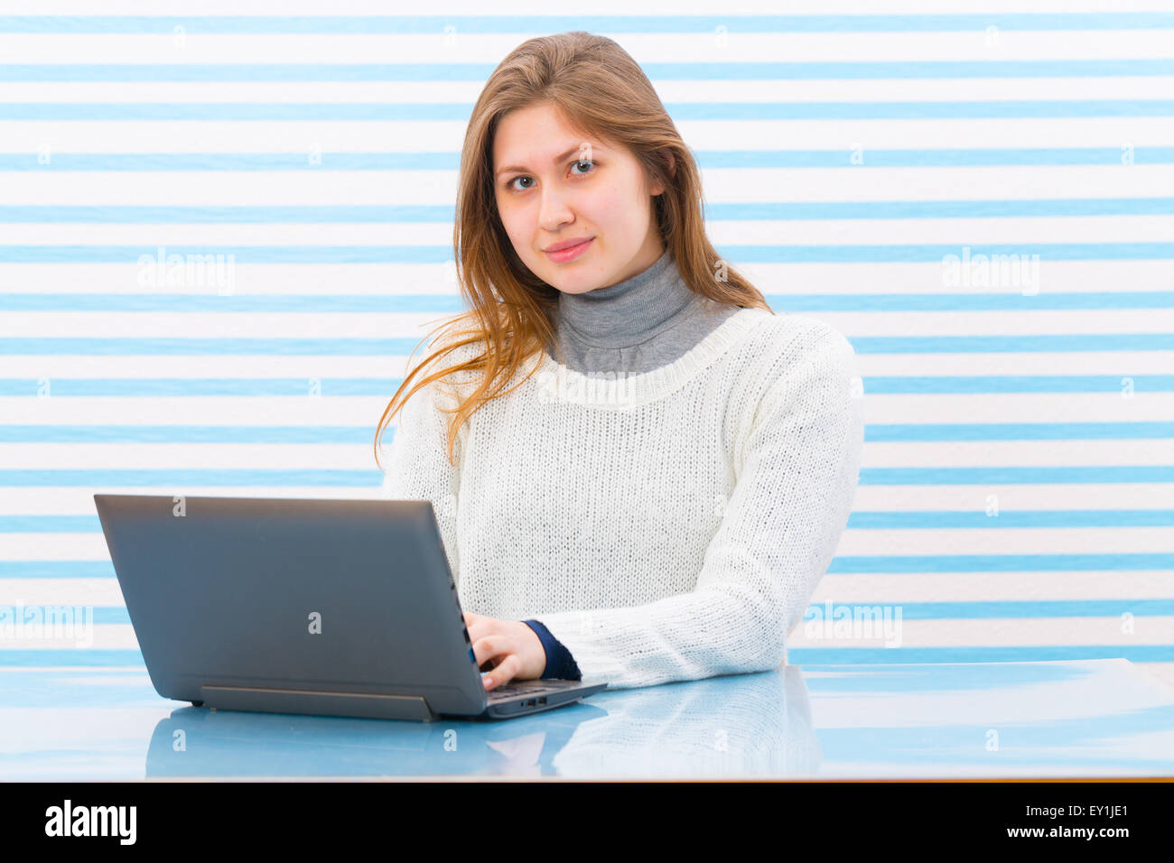 girl working on laptop in office Stock Photo - Alamy