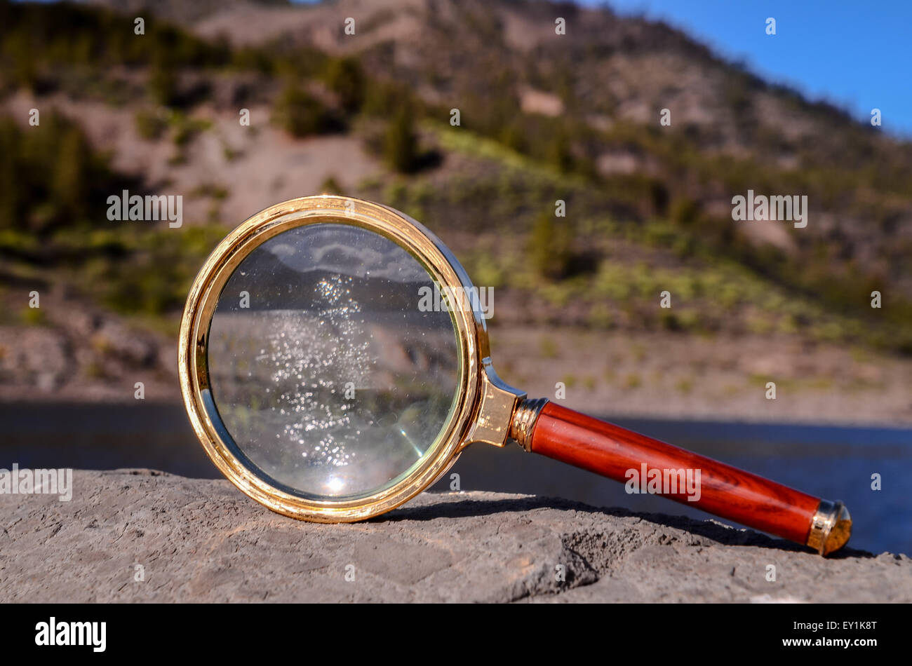 Magnify Glass Loupe on the Volcanic Rock Stock Photo - Alamy