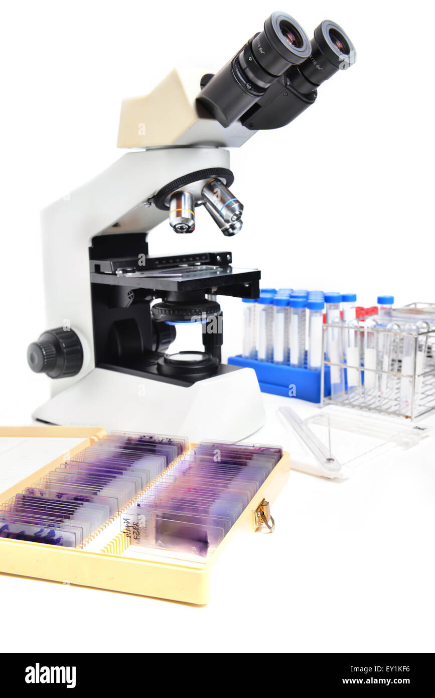 microscope with laboratory equipment on white background Stock Photo ...