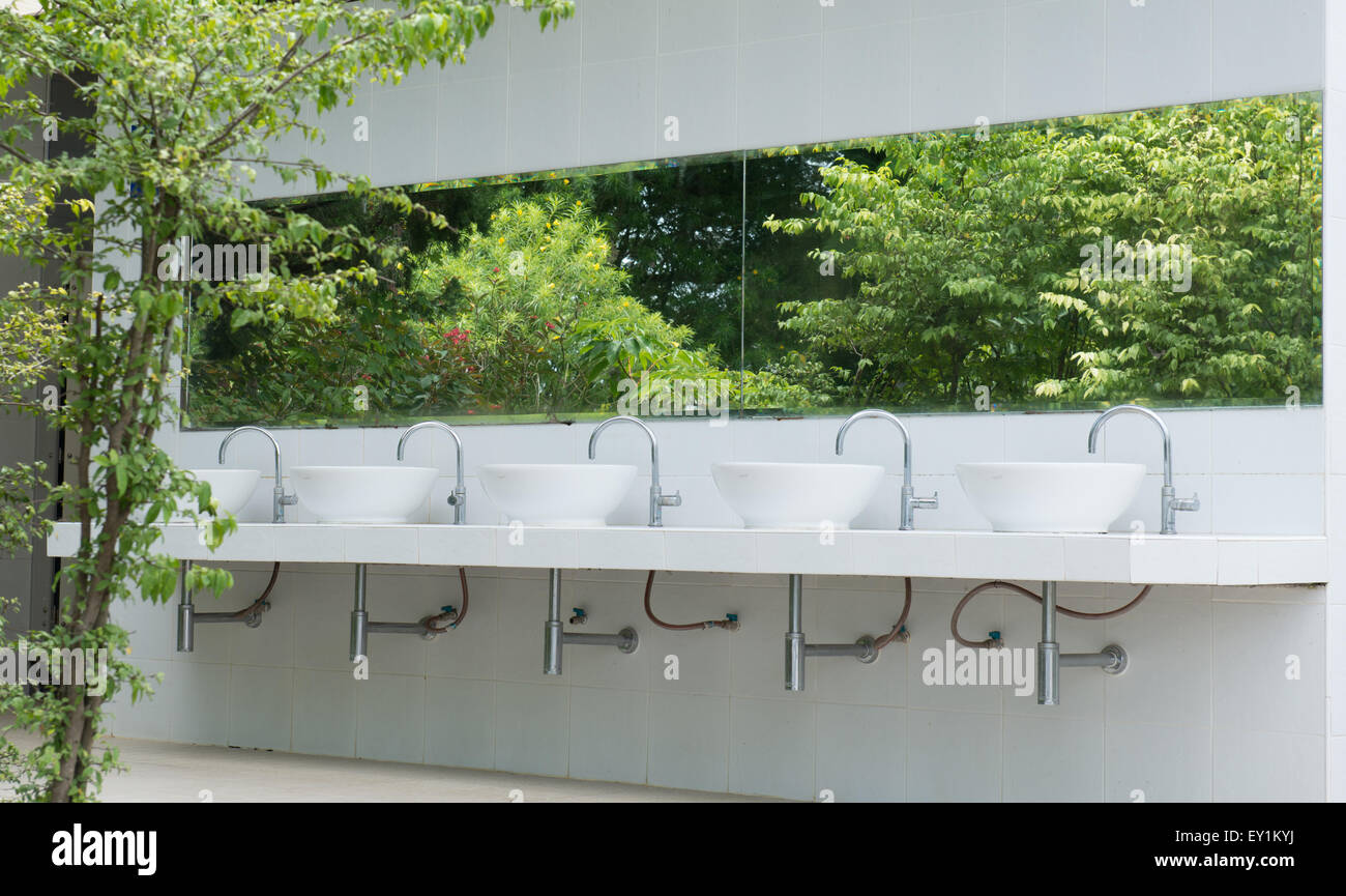 outdoor public toilet with many plant surround Stock Photo - Alamy