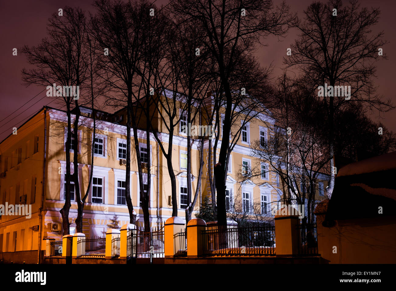 Old town house at winter night. Old house at night, illuminated by the ...