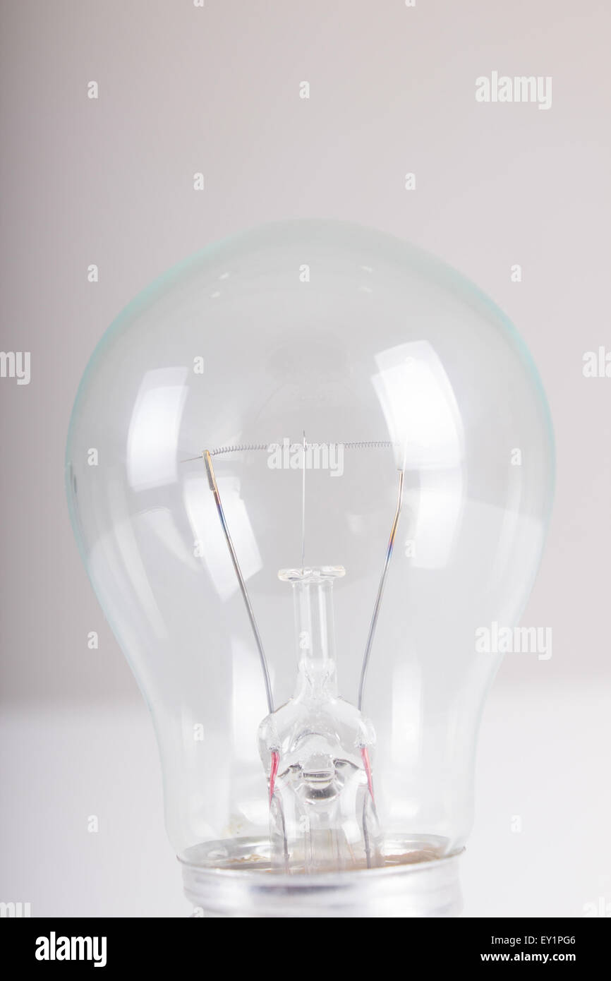 Clear light bulb with filament showing Stock Photo - Alamy