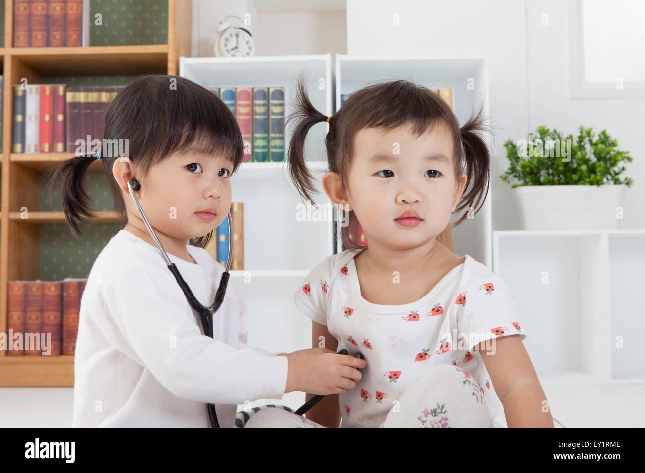 Little girls playing together hi-res stock photography and images - Alamy
