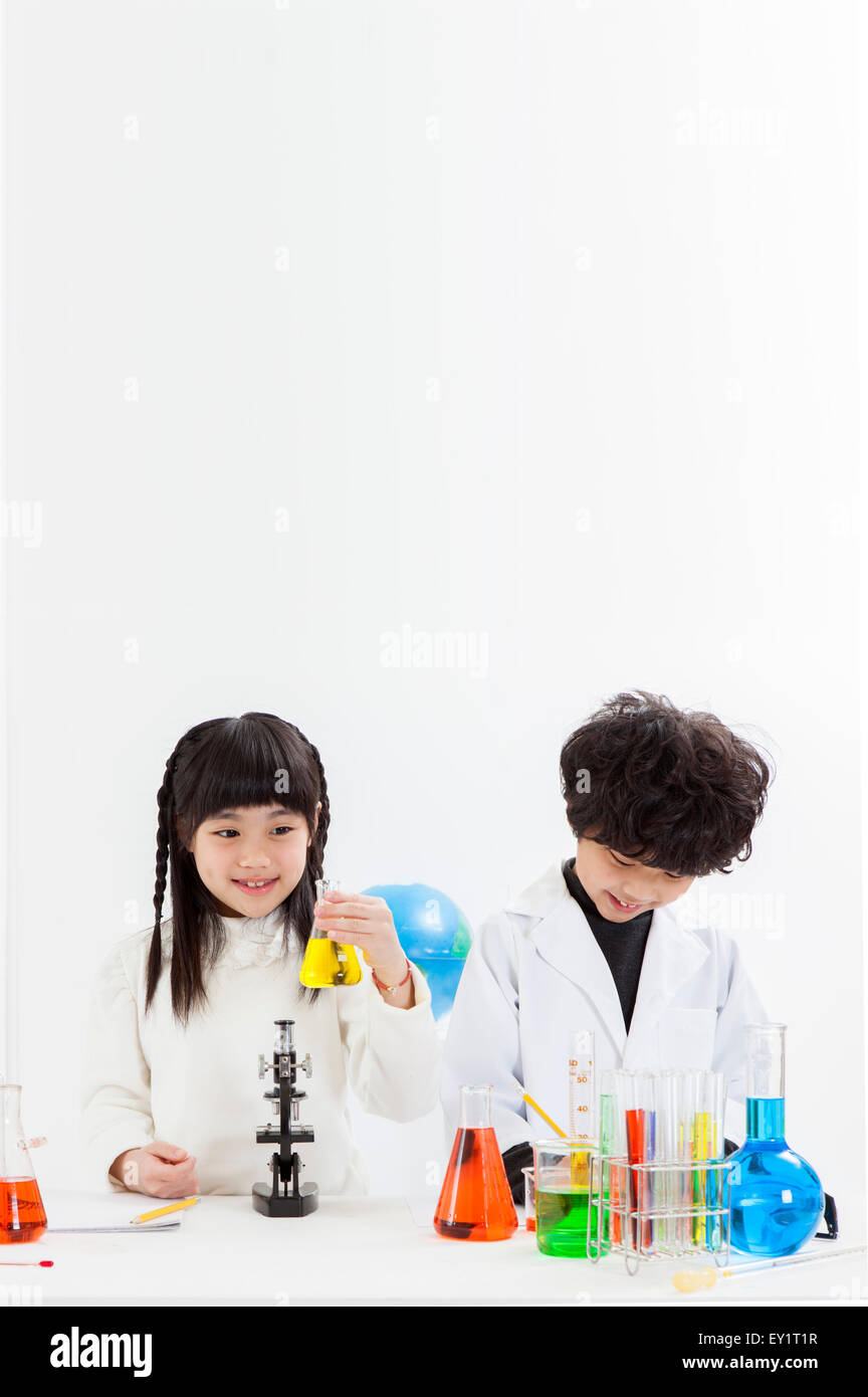 Children doing experiment in the lab with smile together Stock Photo ...