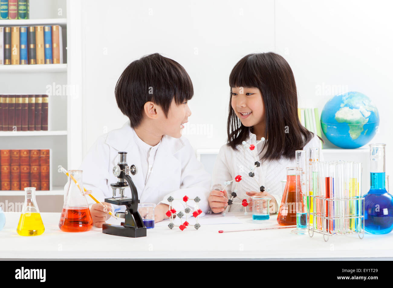 Children doing experiment in the lab with smile together Stock Photo ...