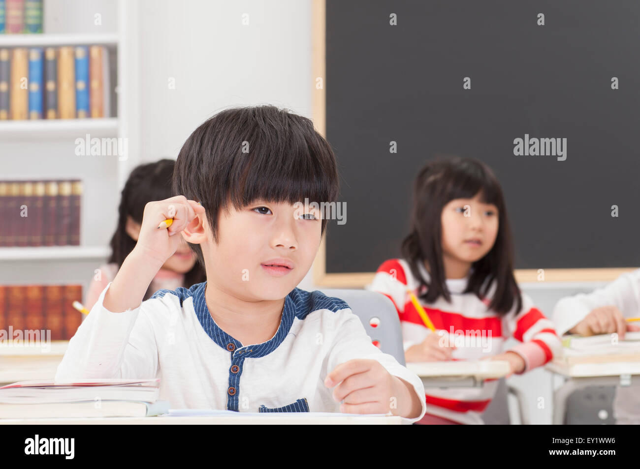 Children sitting in the classroom and studying Stock Photo - Alamy