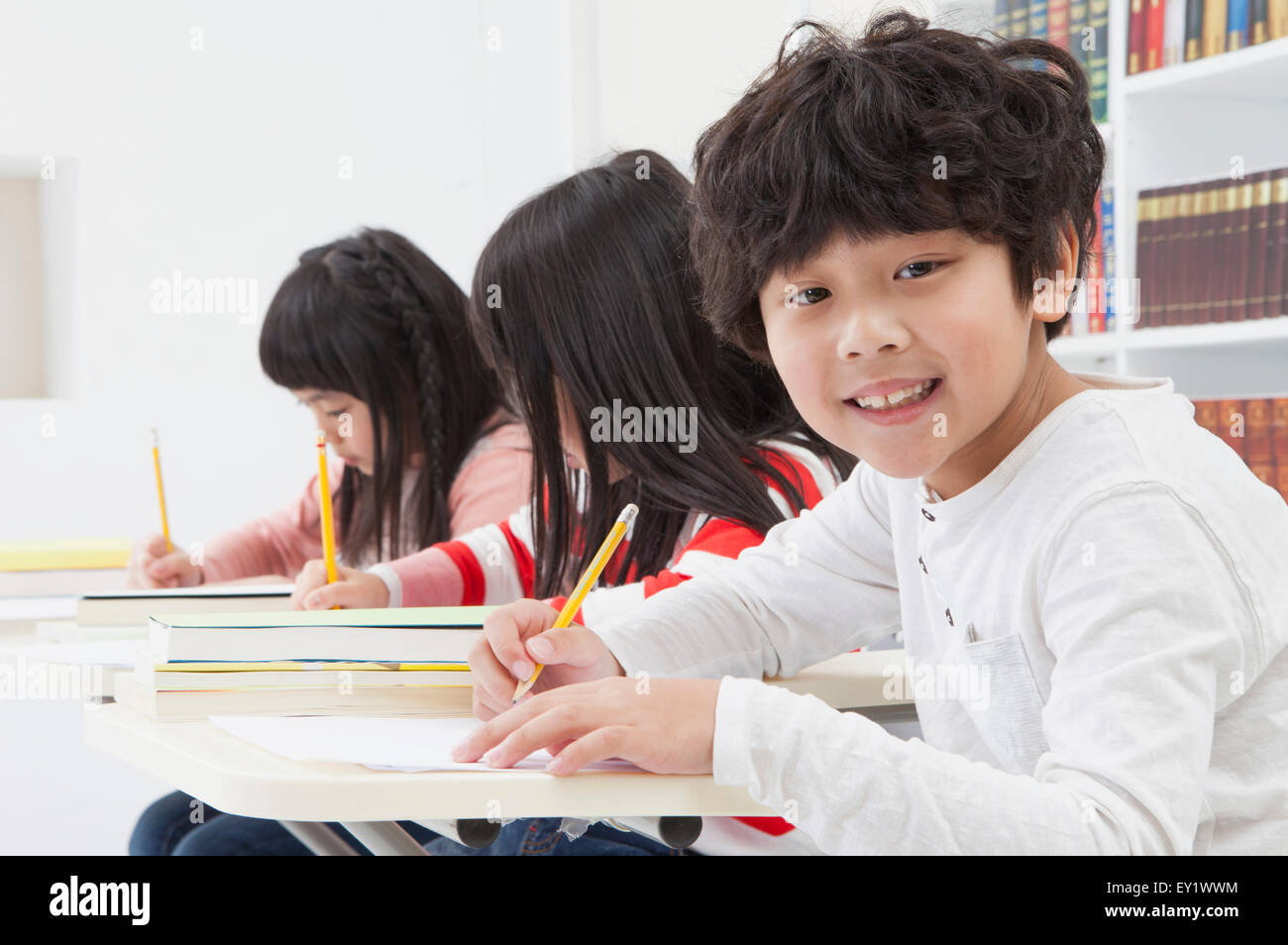 Children studying in the classroom and smiling at the camera Stock ...