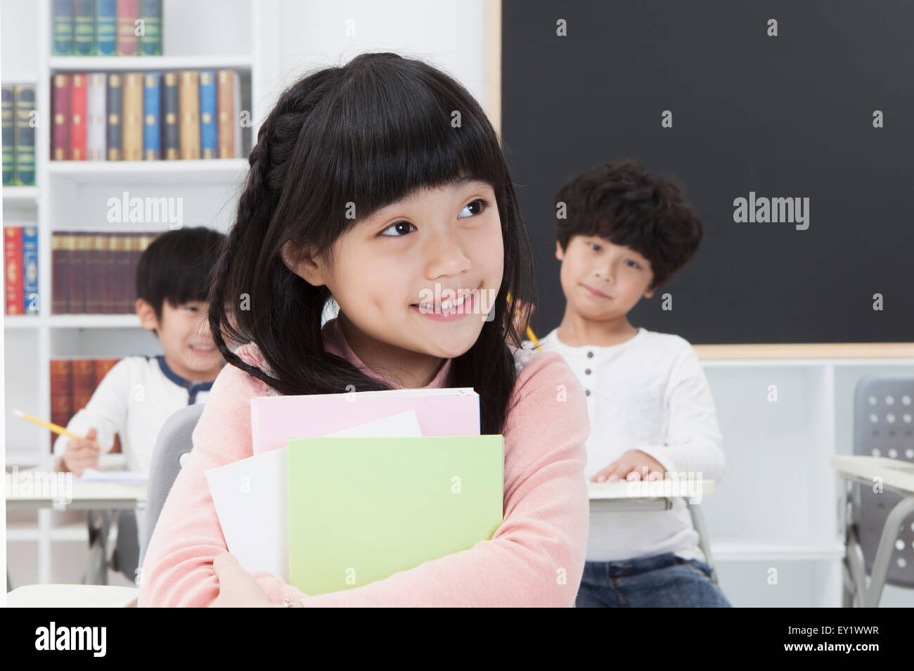 Children studying in the classroom and looking away with smile Stock ...