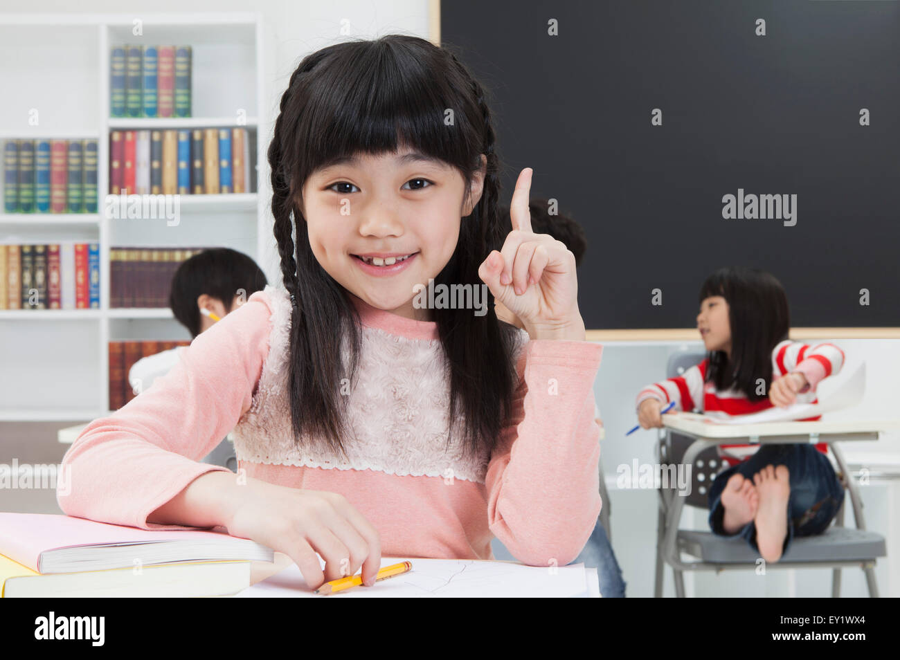 Children sitting in the classroom and studying Stock Photo - Alamy