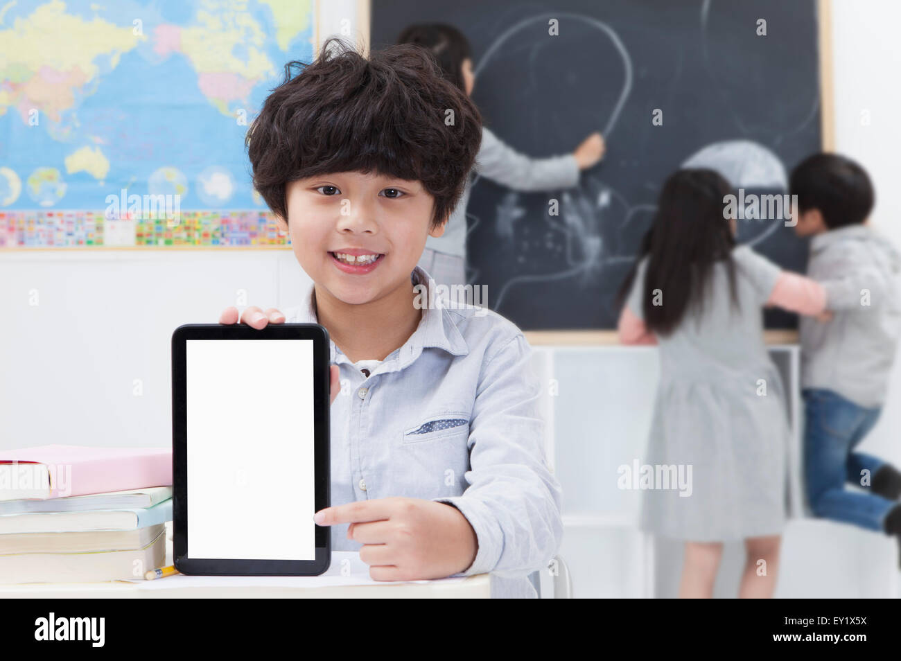 Children studying in the classroom and smiling at the camera Stock ...