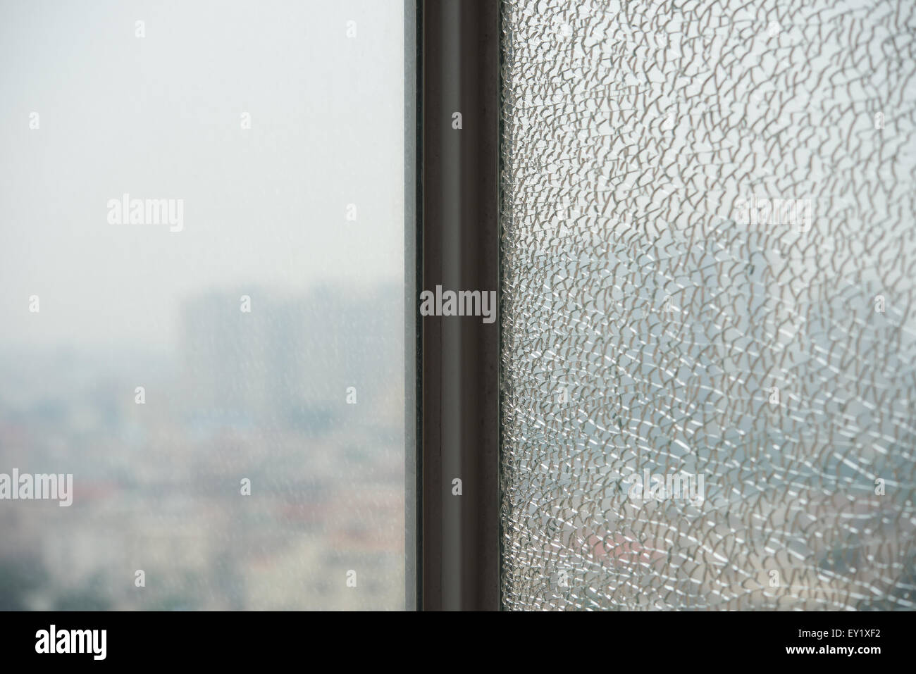 two glass windows with one broken and one intact Stock Photo - Alamy