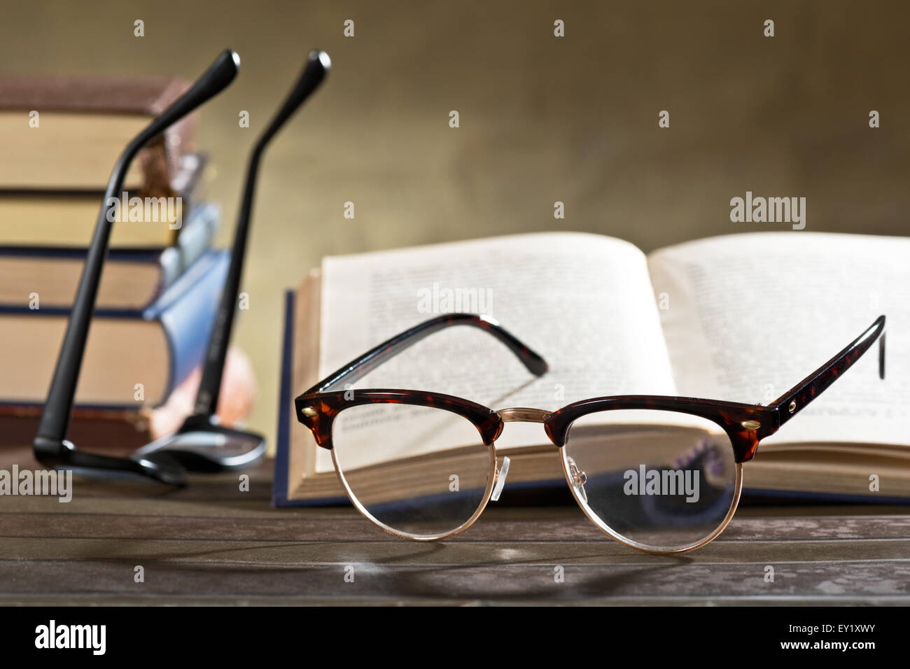 still life with eyeglasses and books on the table Stock Photo - Alamy