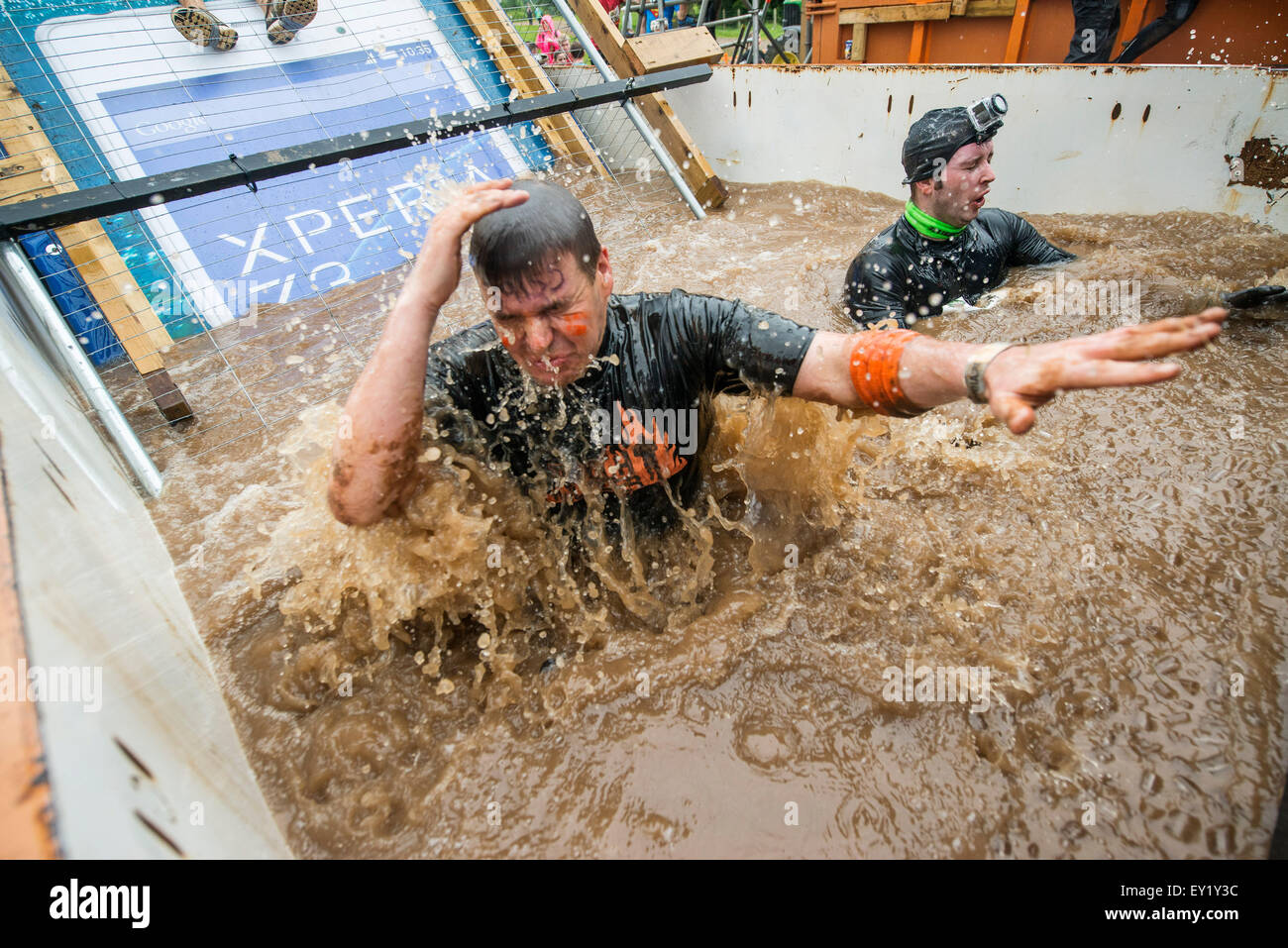 Competitors take part in the Tough Mudder Scotland at Drumlanrig Castle ...