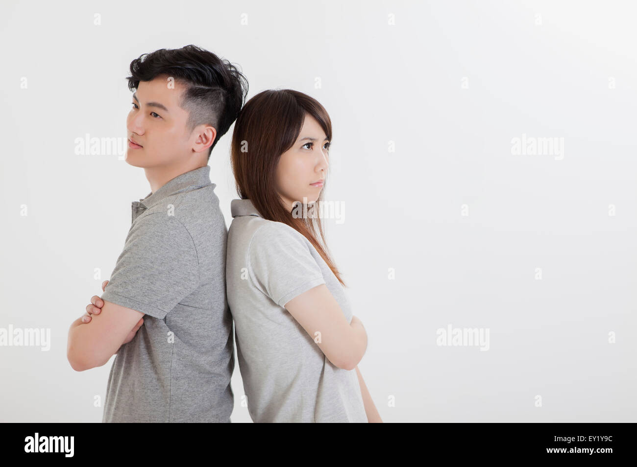 Two women standing back to back hi-res stock photography and images - Alamy