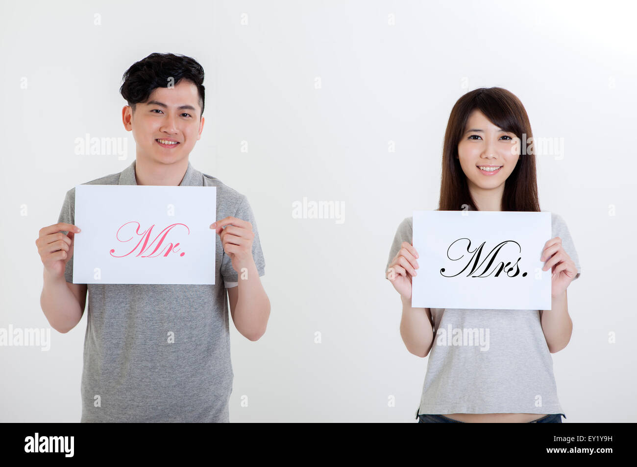 Smiling couple holding paper hi-res stock photography and images - Alamy