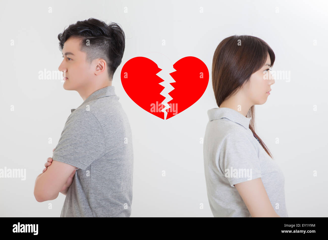 Young couple standing with back to back and heart broken Stock Photo ...