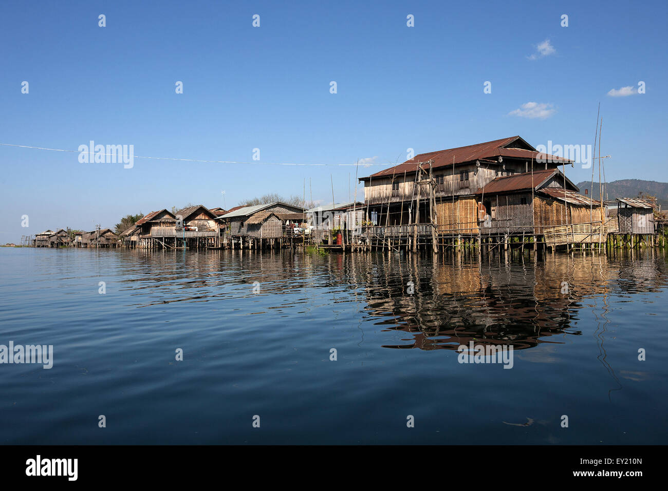 Traditional stilt houses in Inle Lake, reflection in the water, Shan ...