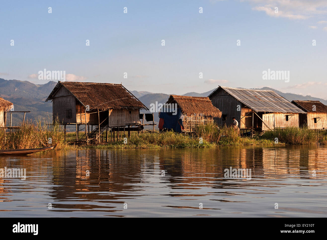Traditional stilt houses on the Inle Lake, evening light, Shan State ...
