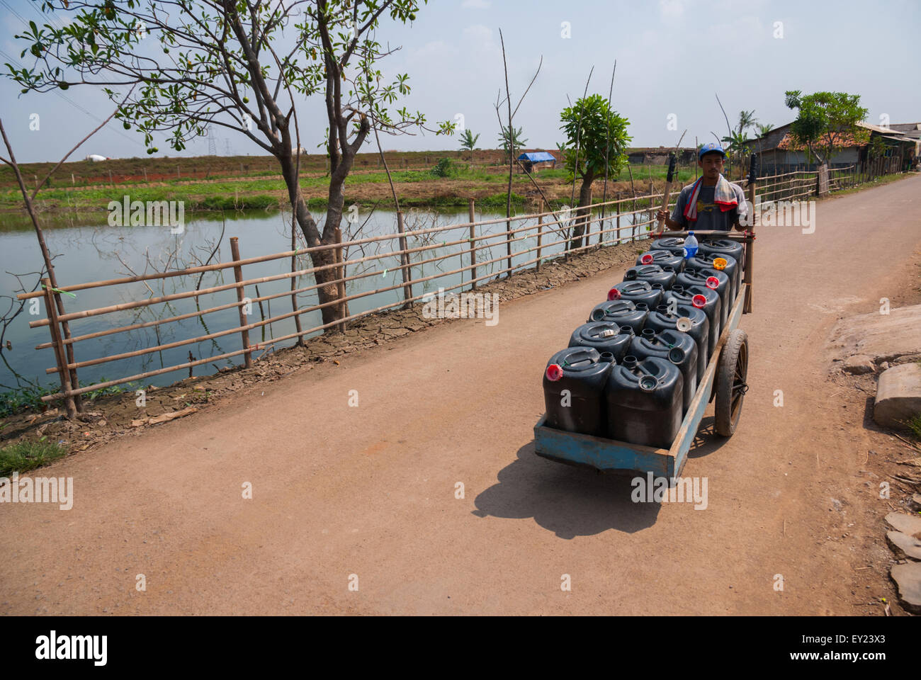 A travelling water salesman is photographed on a suburban road in ...