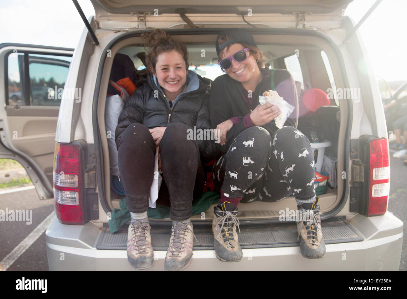 Hikers taking break at back of car, Smith Rock State Park, Oregon, US ...
