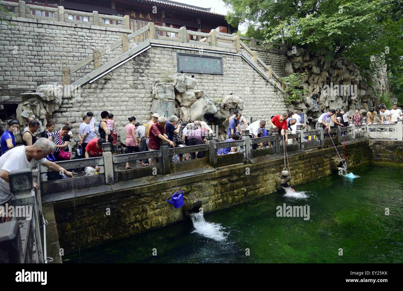 Jinan, China's Shandong Province. 20th July, 2015. Citizens get water ...