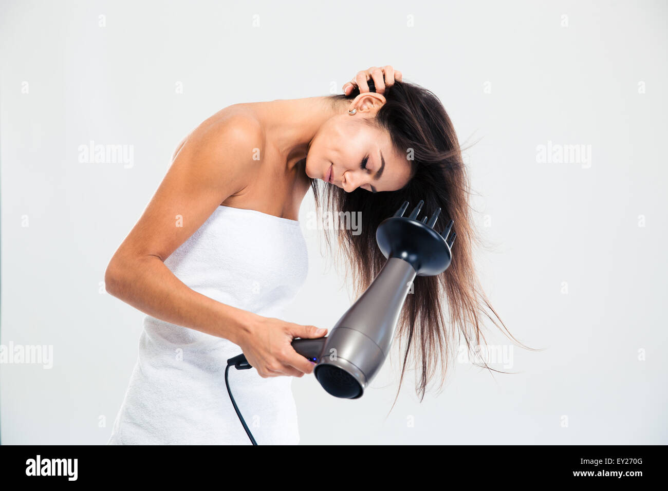 Woman blow drying hair hi-res stock photography and images - Alamy