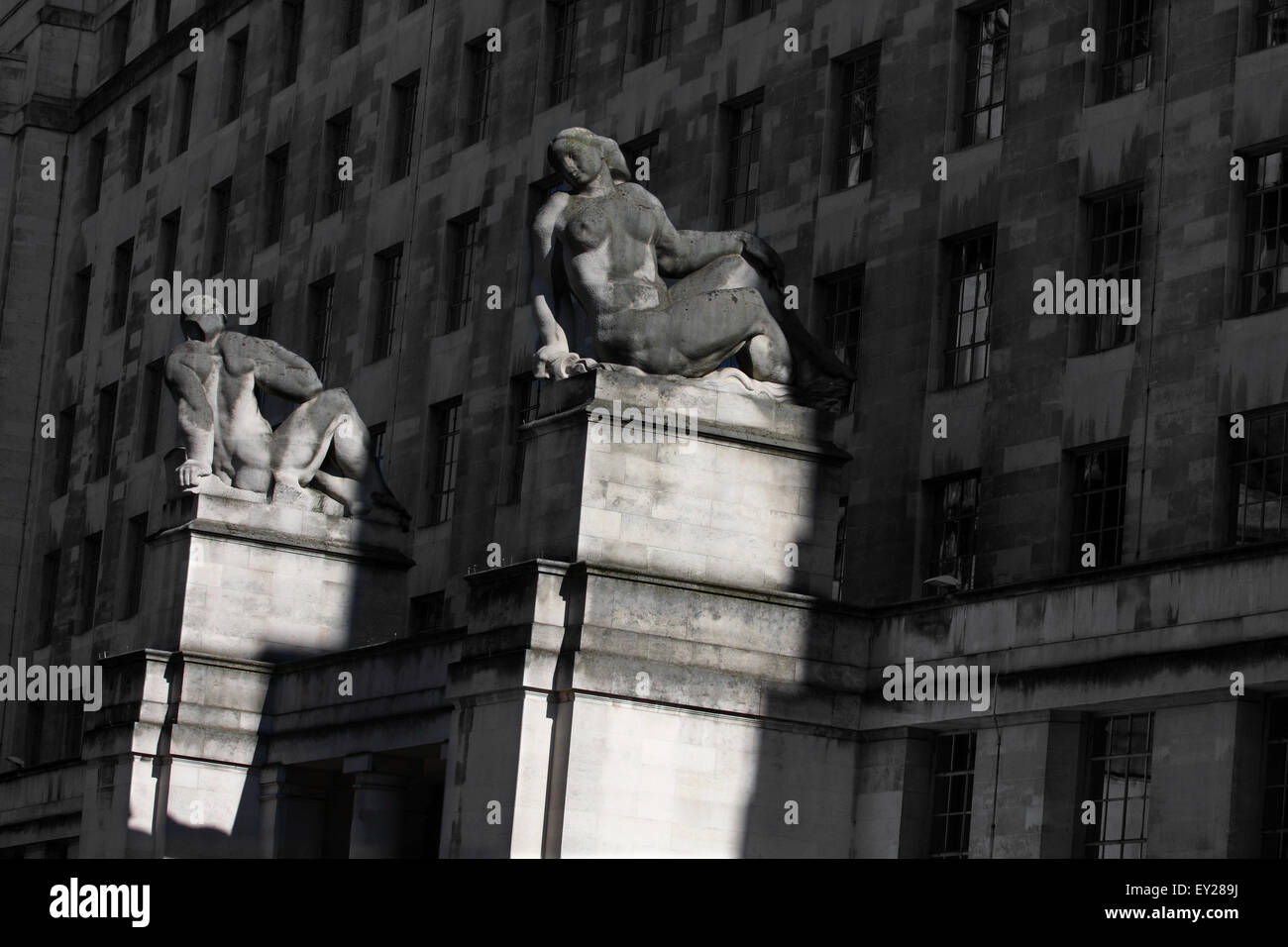 Two statues are highlighted by sunshine in Horseguards Avenue ...