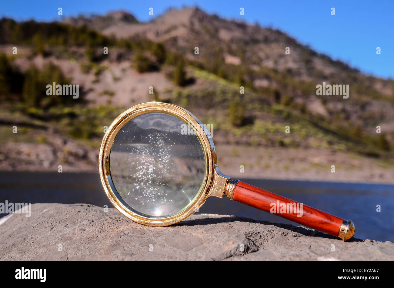 Magnify Glass Loupe on the Volcanic Rock Stock Photo - Alamy