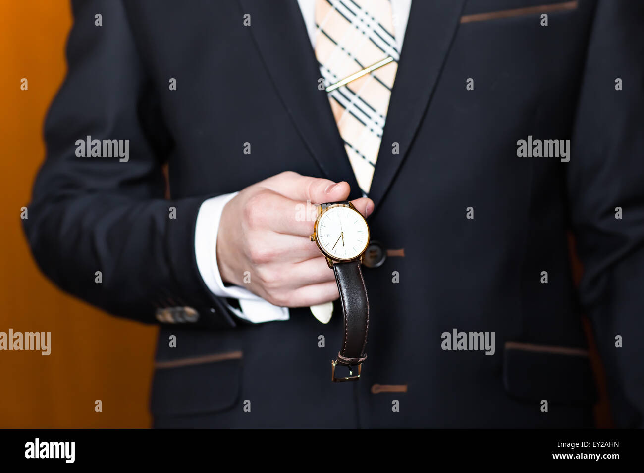 young business man looking at watch over white background Stock Photo ...