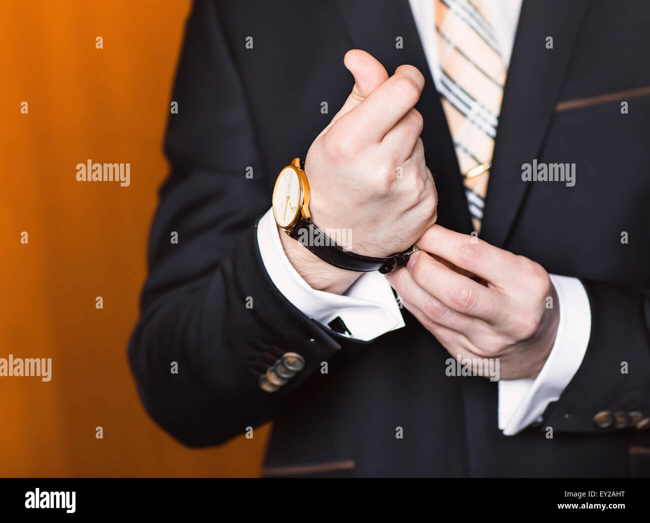 young business man looking at watch over white background Stock Photo ...