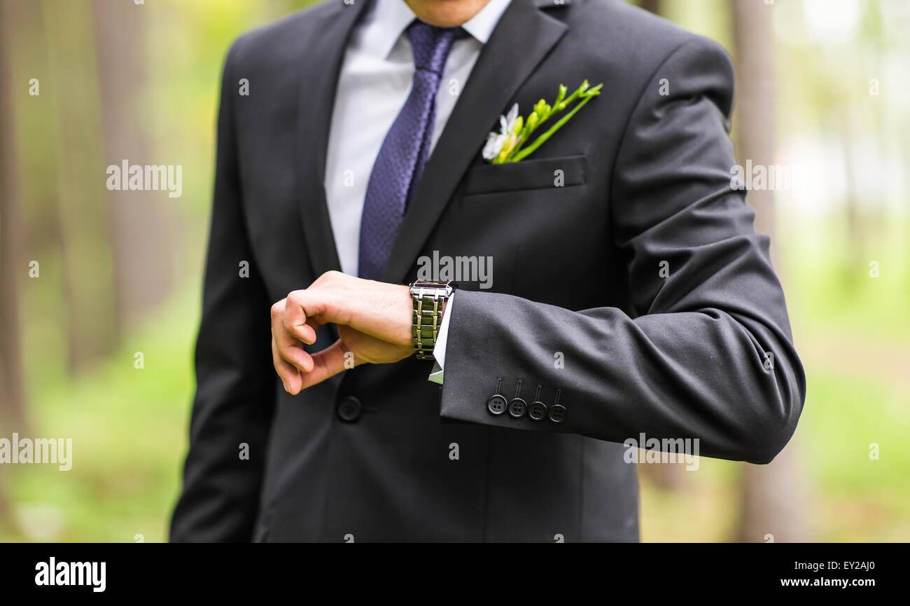 young business man looking at watch over white background Stock Photo ...